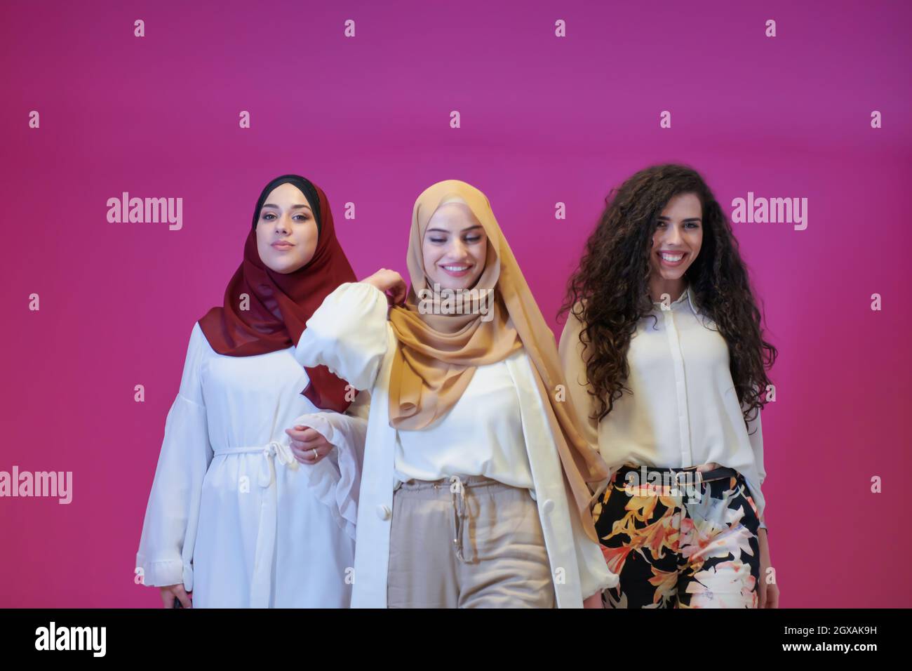 group portrait of beautiful muslim women two of them in fashionable ...