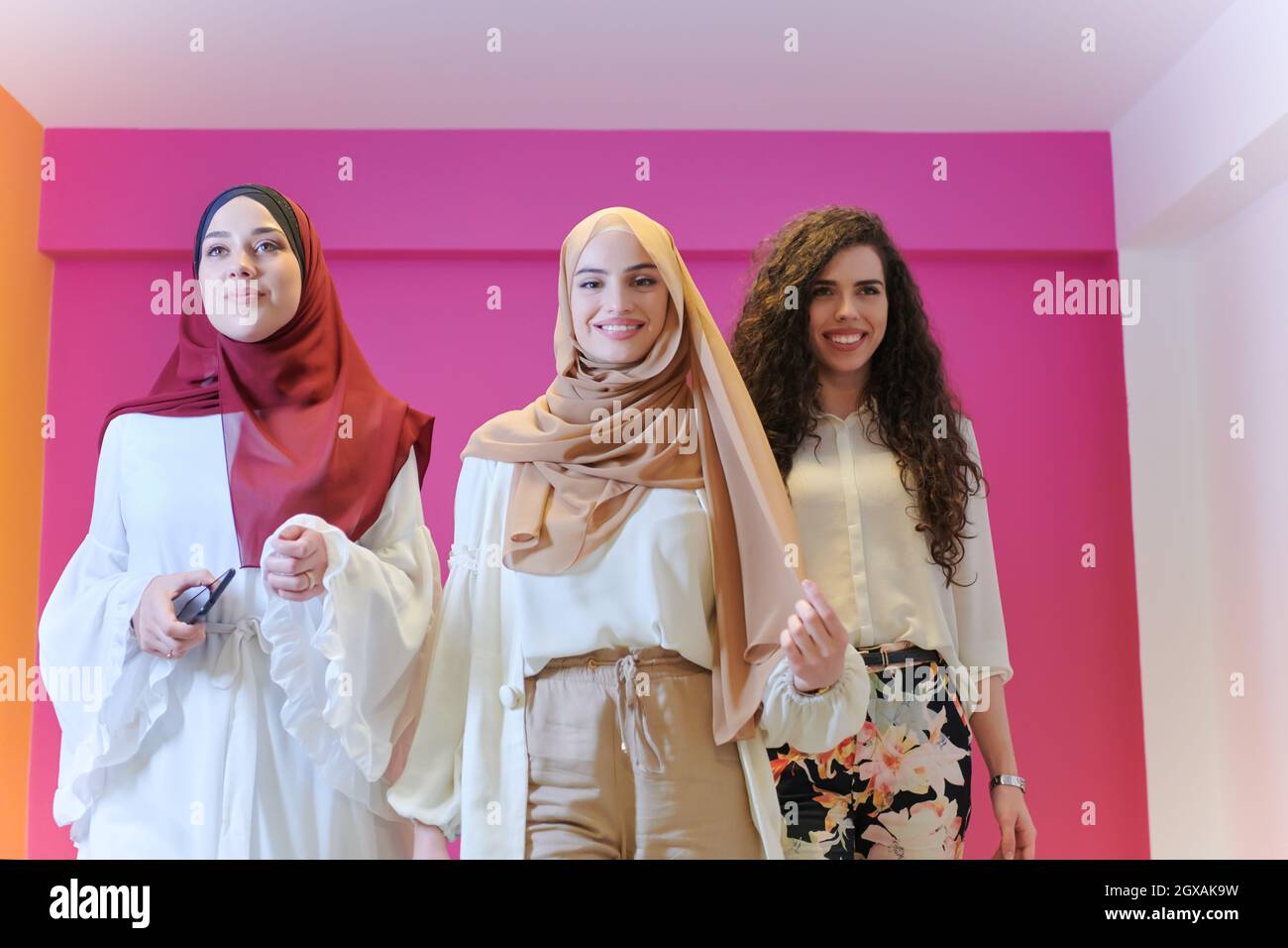 group portrait of beautiful muslim women two of them in fashionable ...