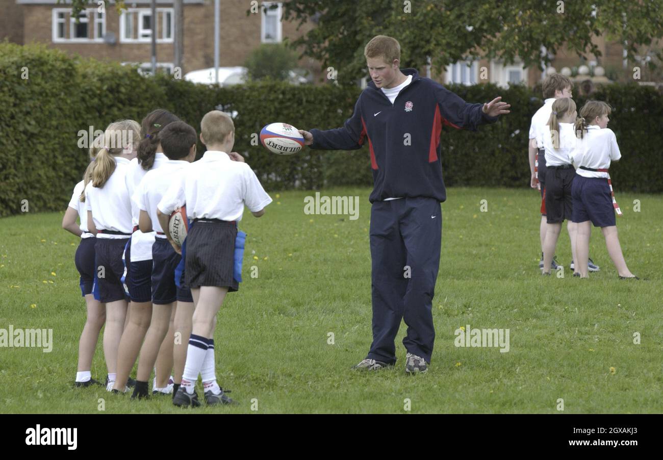 WALSALL, ENGLAND - SEPTEMBER 28: Prince Harry helps in the training of ...