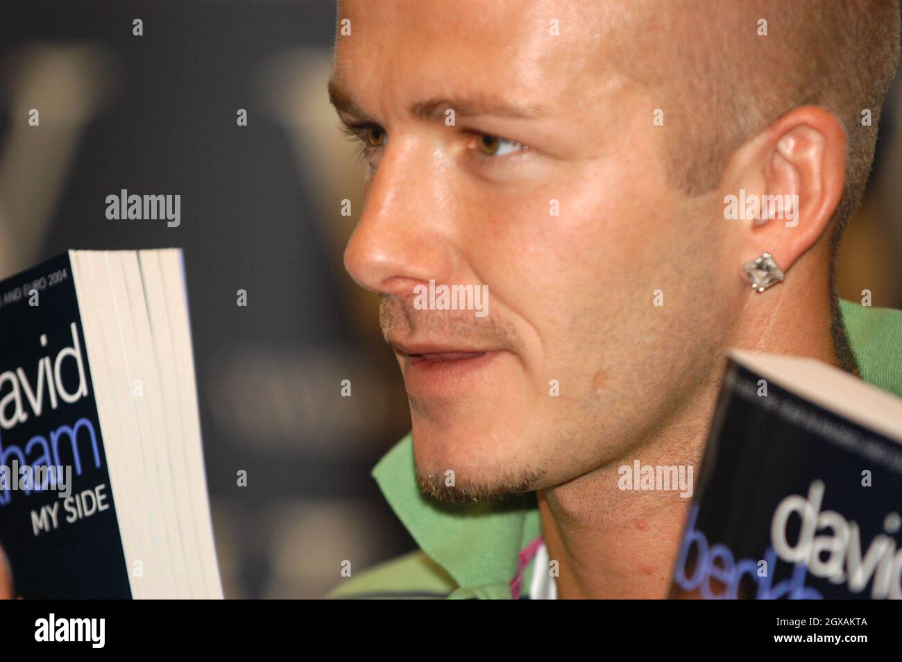 David Beckham singing cpies of his latest autobiography My Side at ...