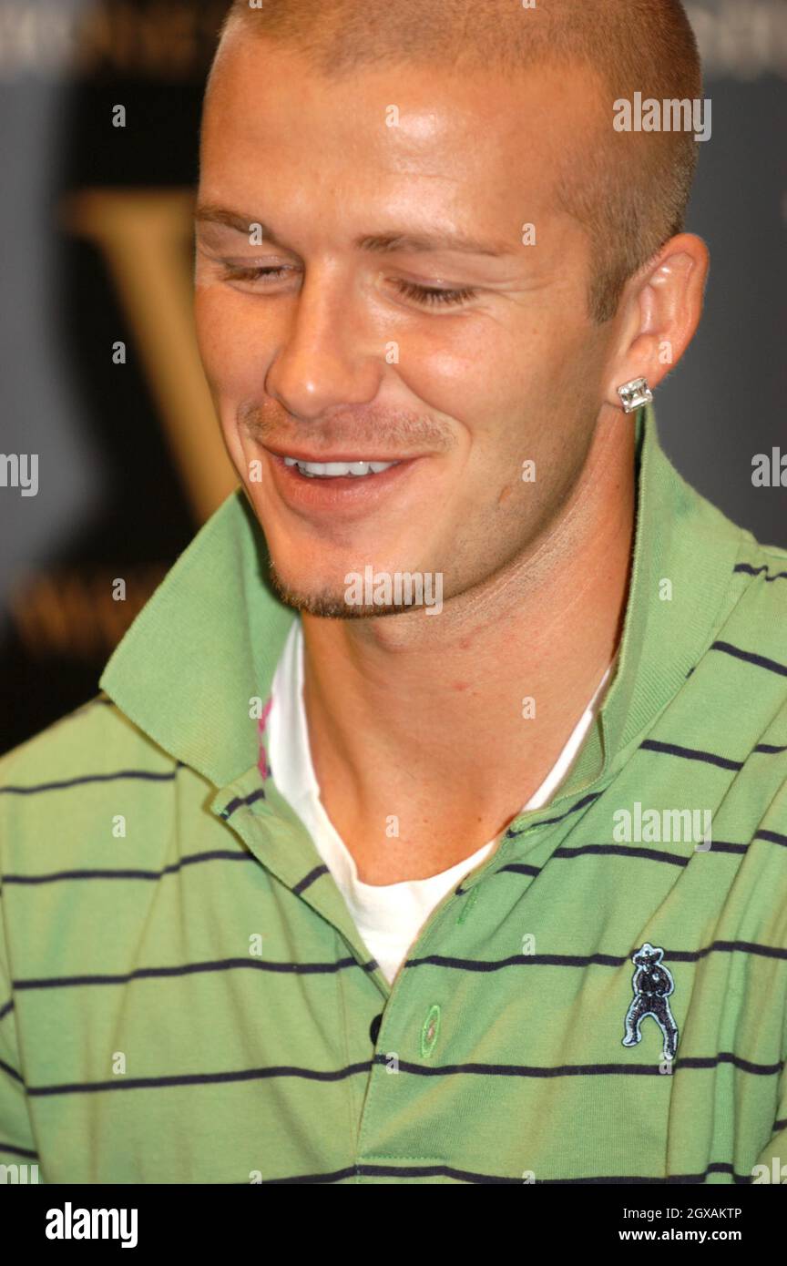 David Beckham singing cpies of his latest autobiography My Side at ...