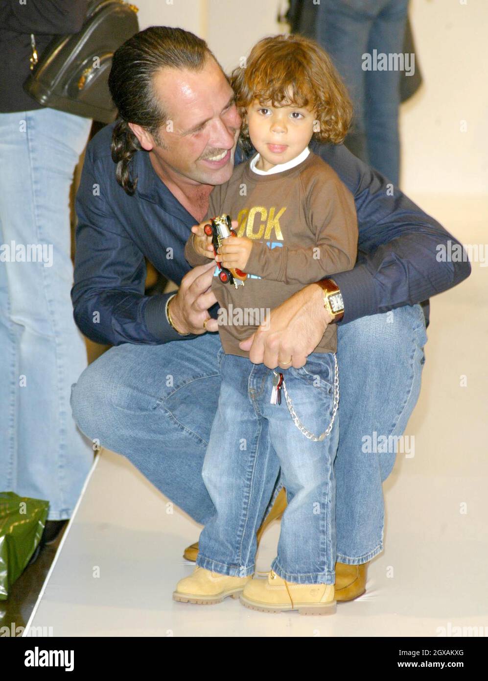 David Seaman and child at the D & G children's fashion show at Harrod's ...