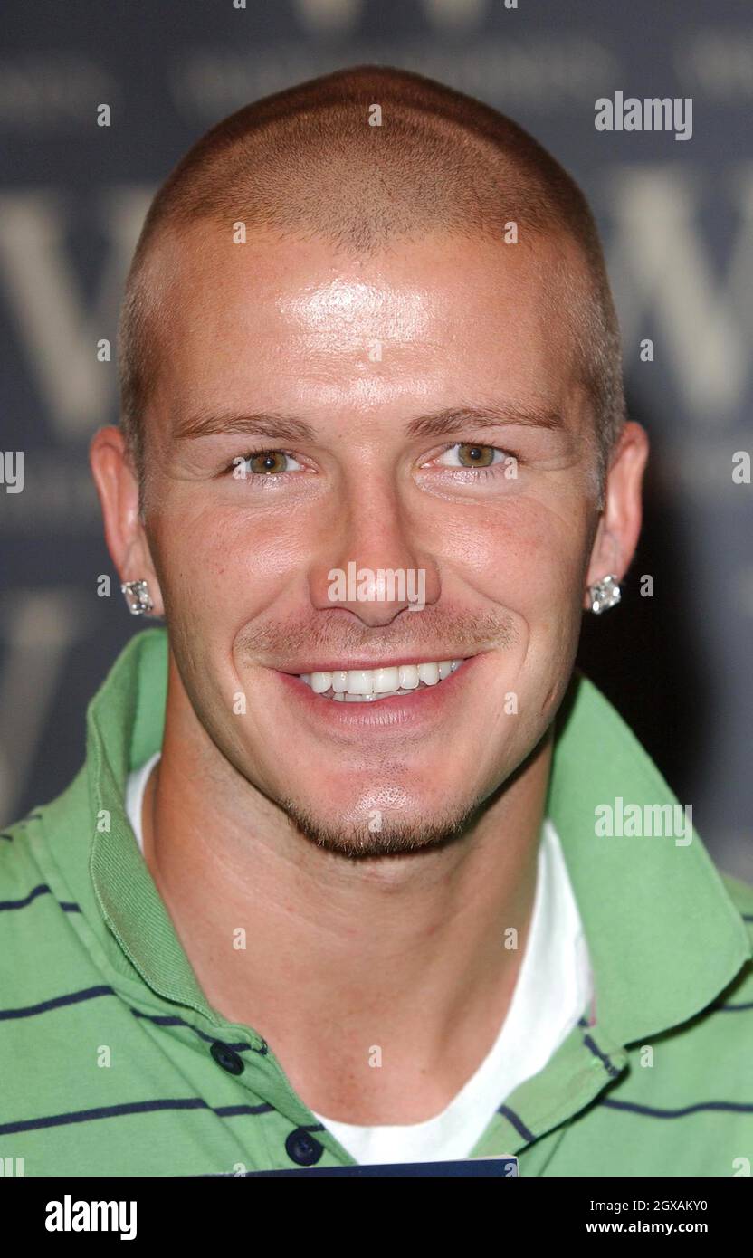 David Beckham singing cpies of his latest autobiography My Side at ...