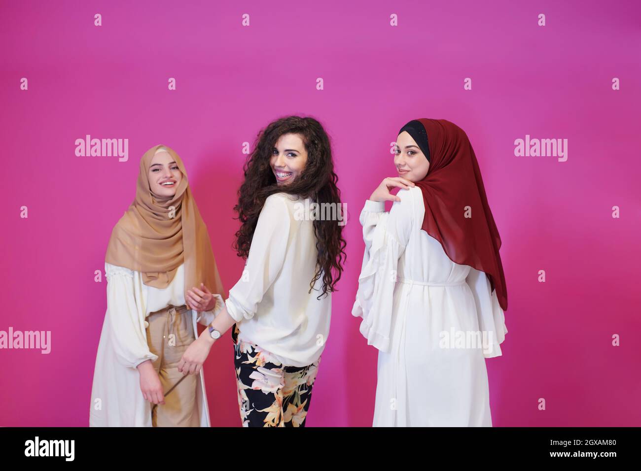 group portrait of beautiful muslim women two of them in fashionable ...