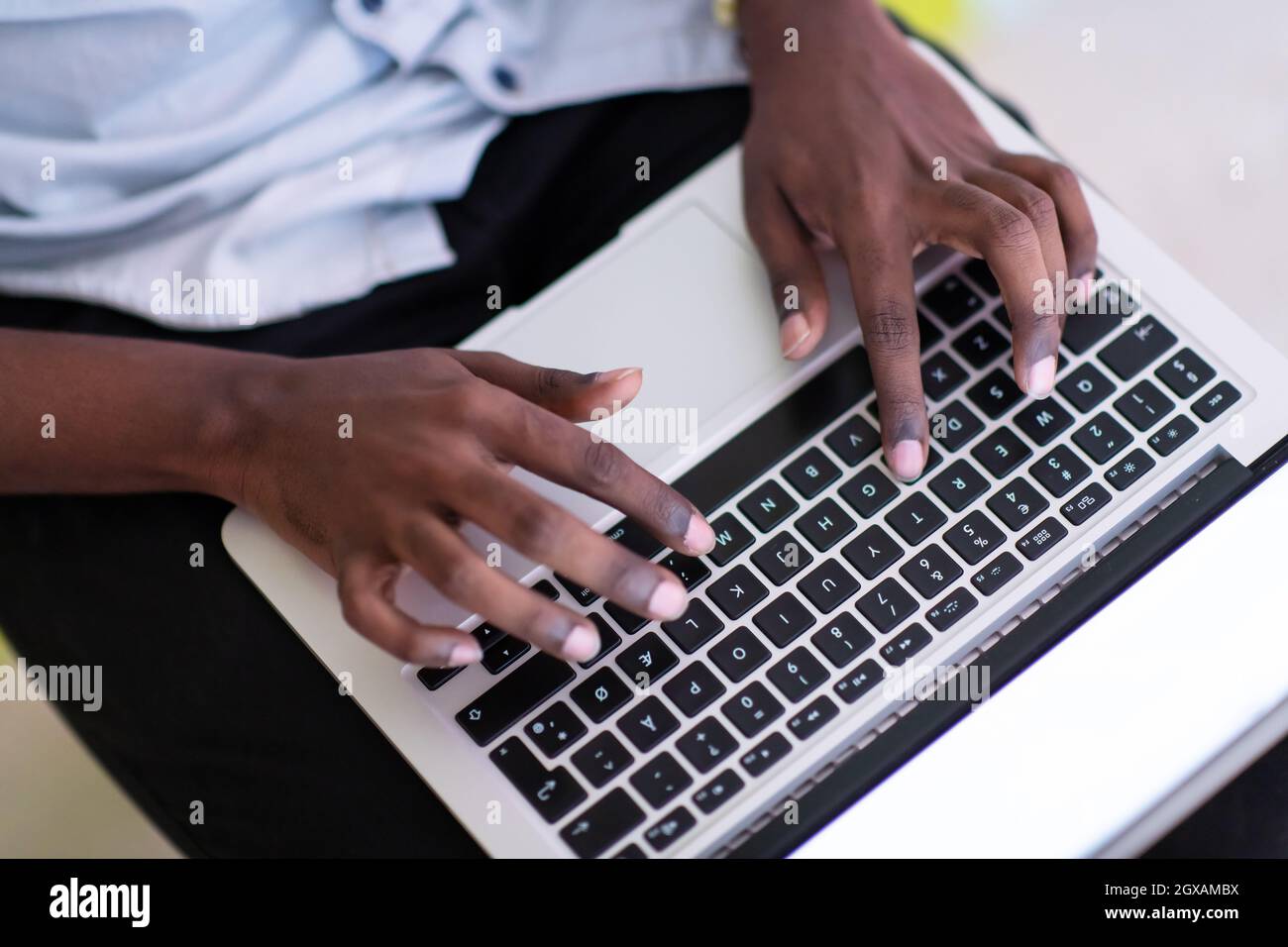 Close up shot of African student using laptop computer to study and ...