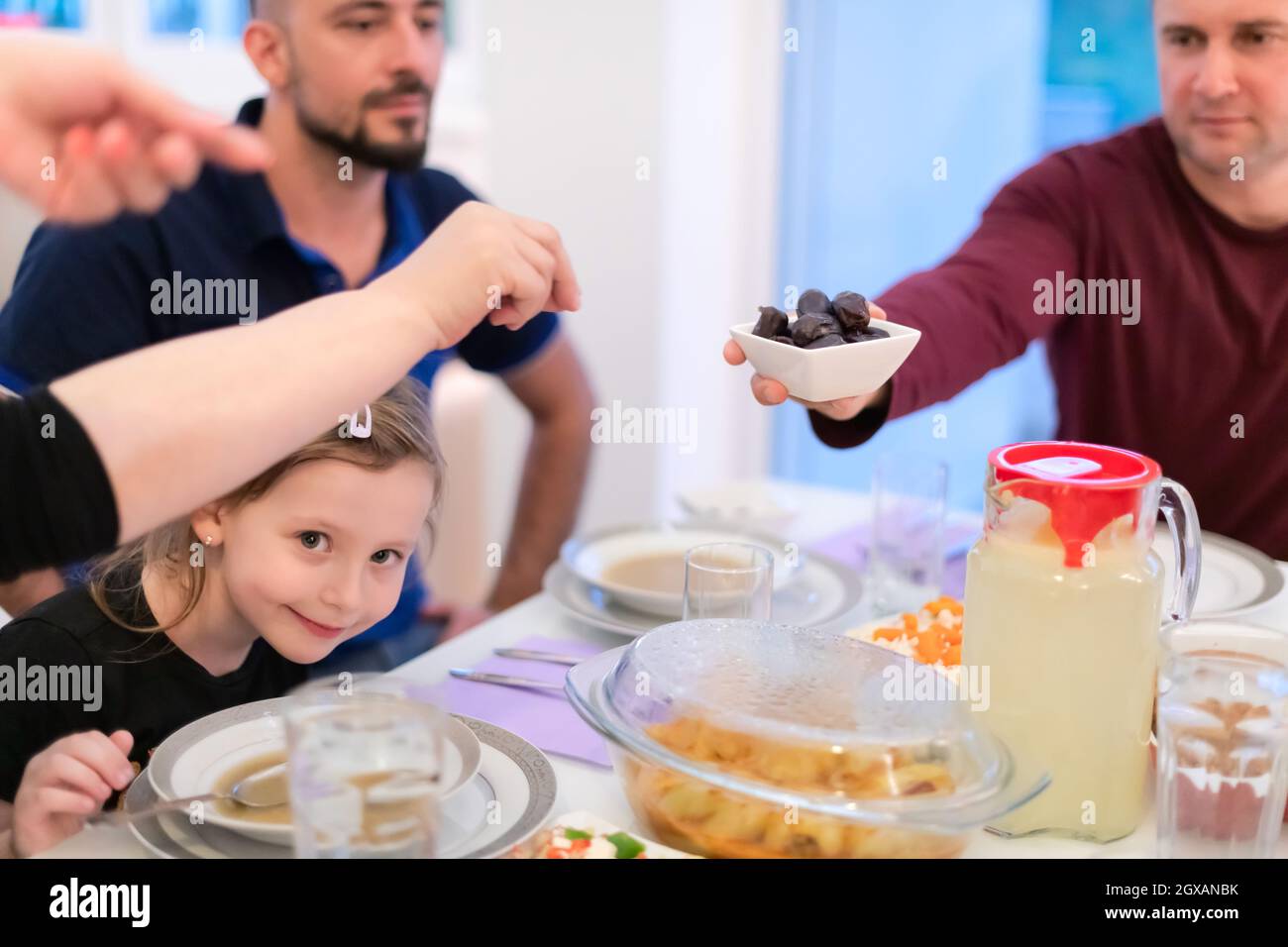 Eid Mubarak Muslim family having Iftar dinner eating dates to break ...