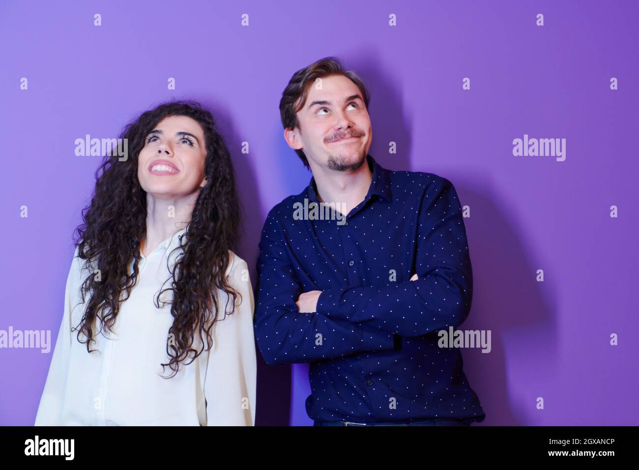 portrait of young happy positive optimistic loving couple posing ...