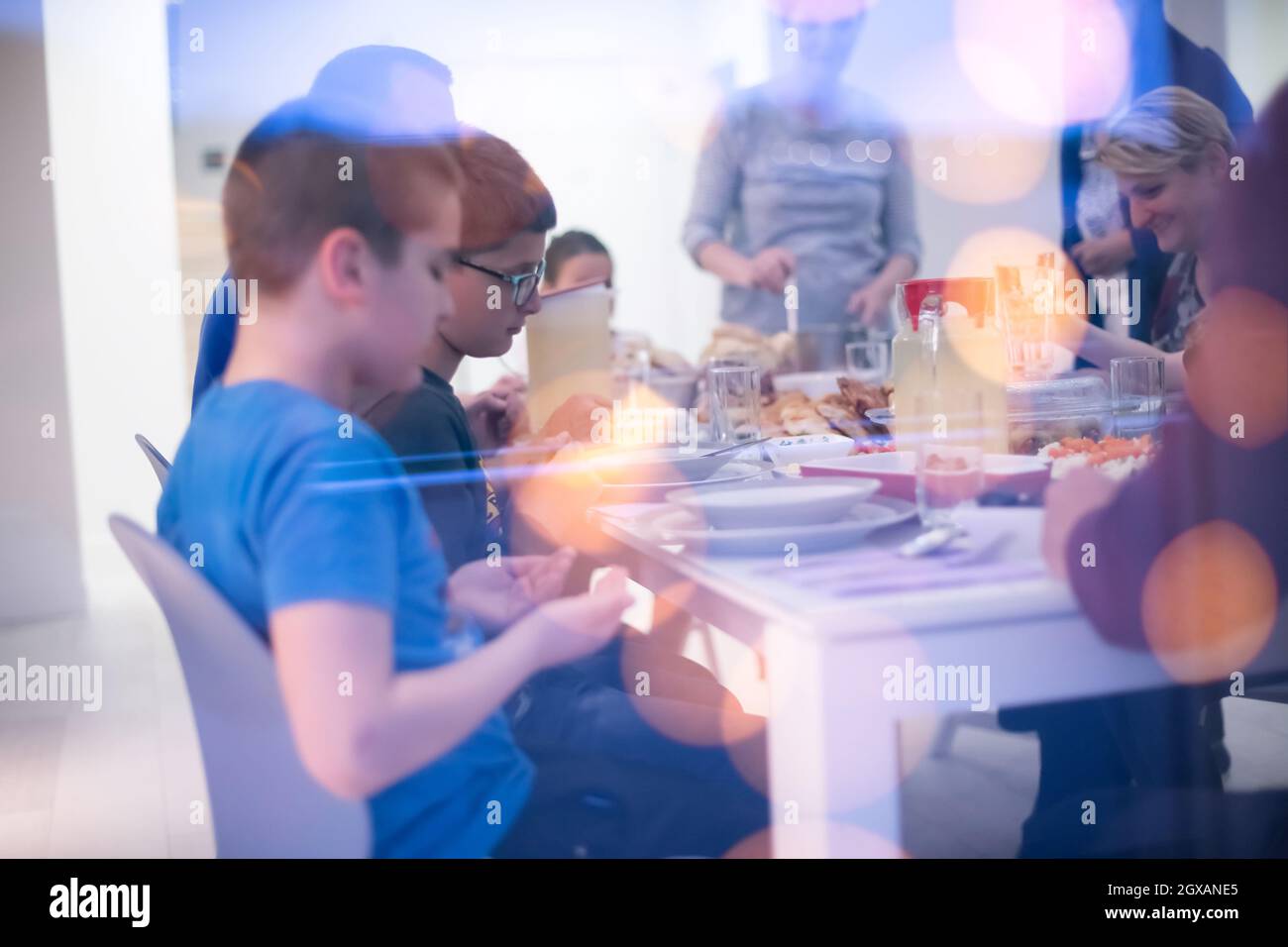 Eid Mubarak Muslim people praying before iftar dinner. Eating ...