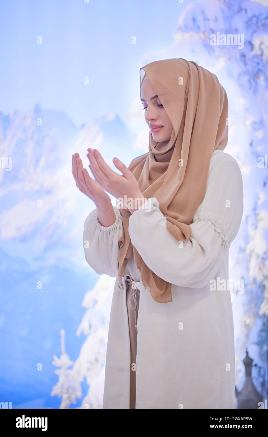 Muslim woman making traditional prayer hi-res stock photography and ...