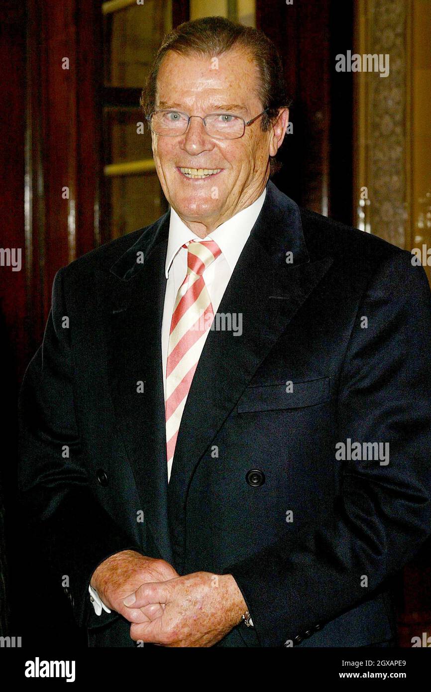 Jack Cardiff and Sir Roger Moore are arriving at the One Whitehall ...