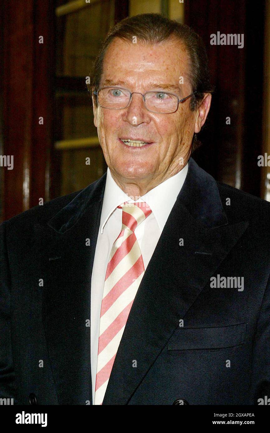 Jack Cardiff and Sir Roger Moore are arriving at the One Whitehall ...