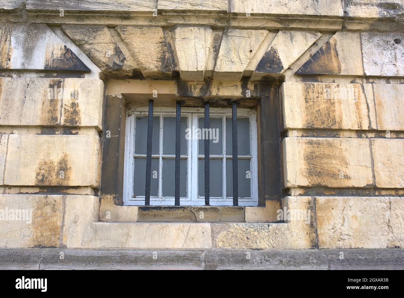 Window of an old building with metal bars Stock Photo - Alamy