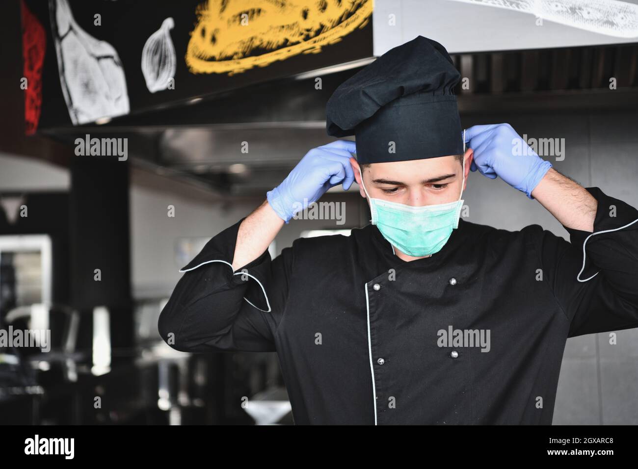 chef cook wearing face protective medical mask for protection from ...