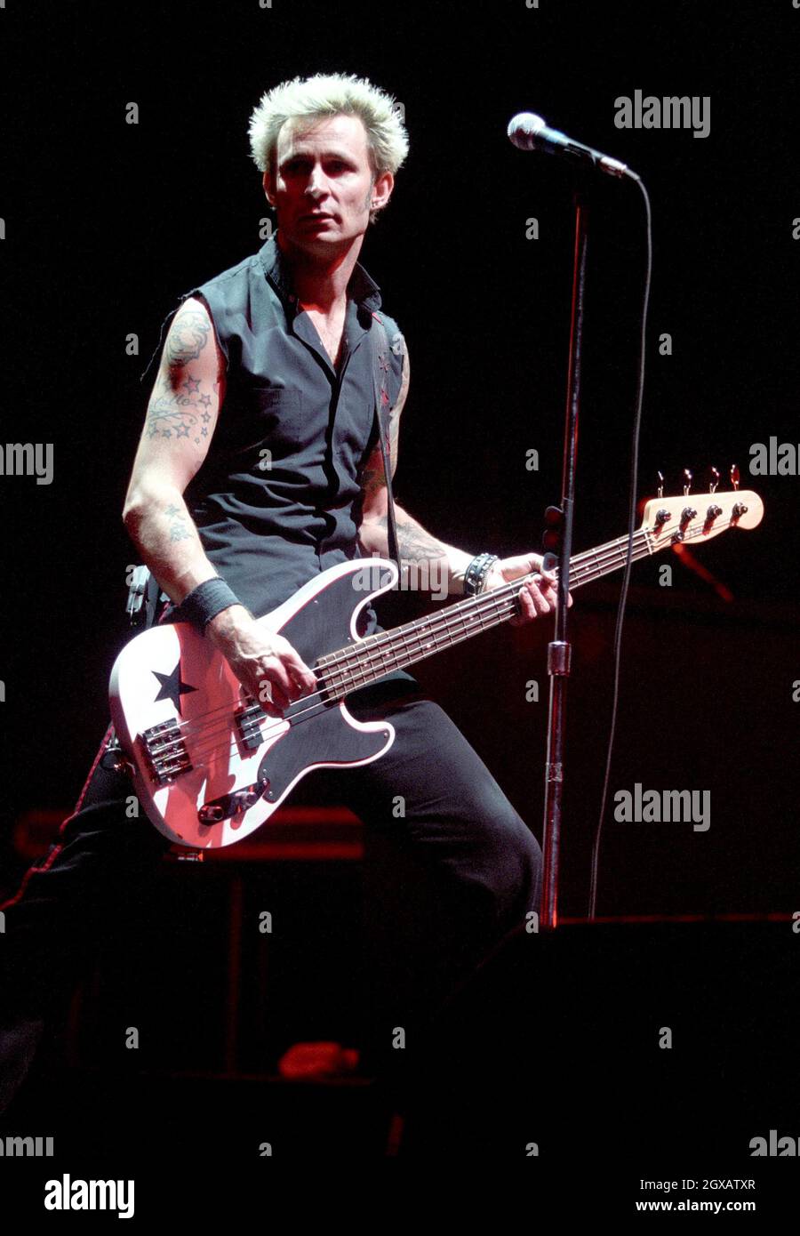 Mike Dirnt of Green Day performs at the Pacific Coliseum in Vancouver ...