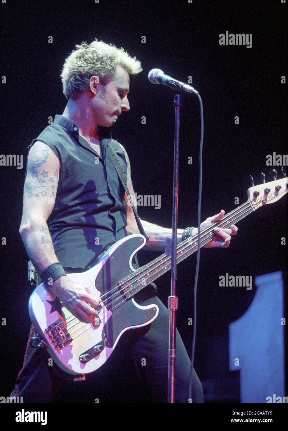 Mike Dirnt of Green Day performs at the Pacific Coliseum in Vancouver ...