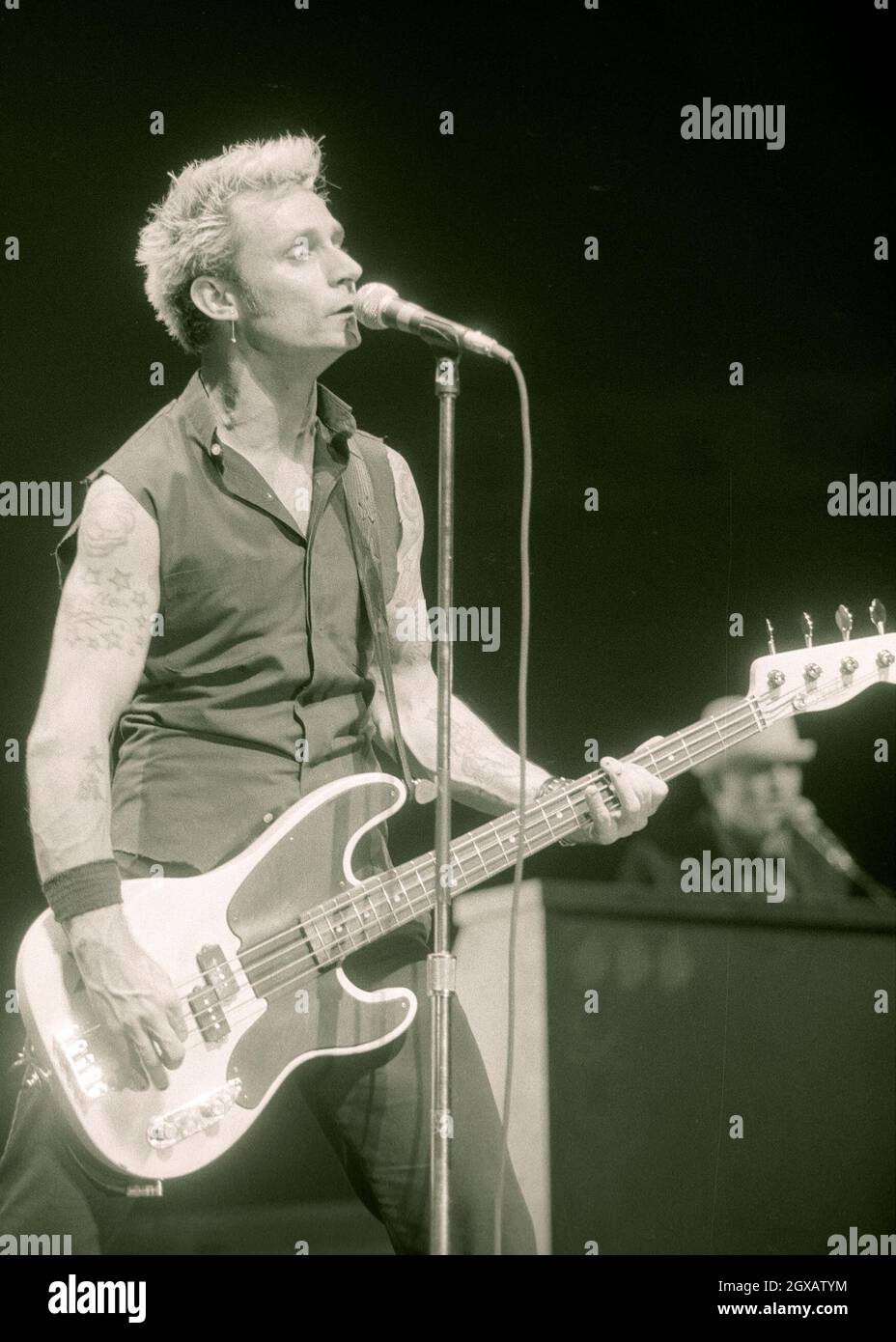 Mike Dirnt of Green Day performs at the Pacific Coliseum in Vancouver ...