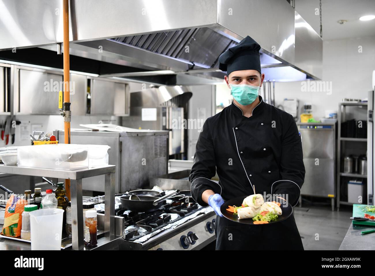 chef cook wearing face protective medical mask for protection from ...