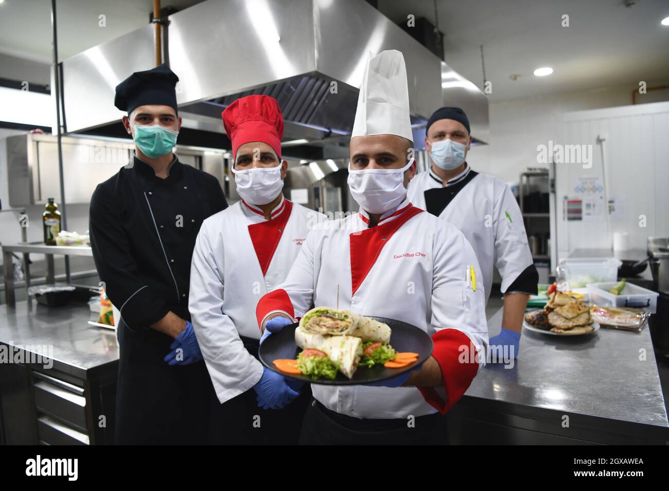 Mixed race team Portrait of group chefs standing together in the ...
