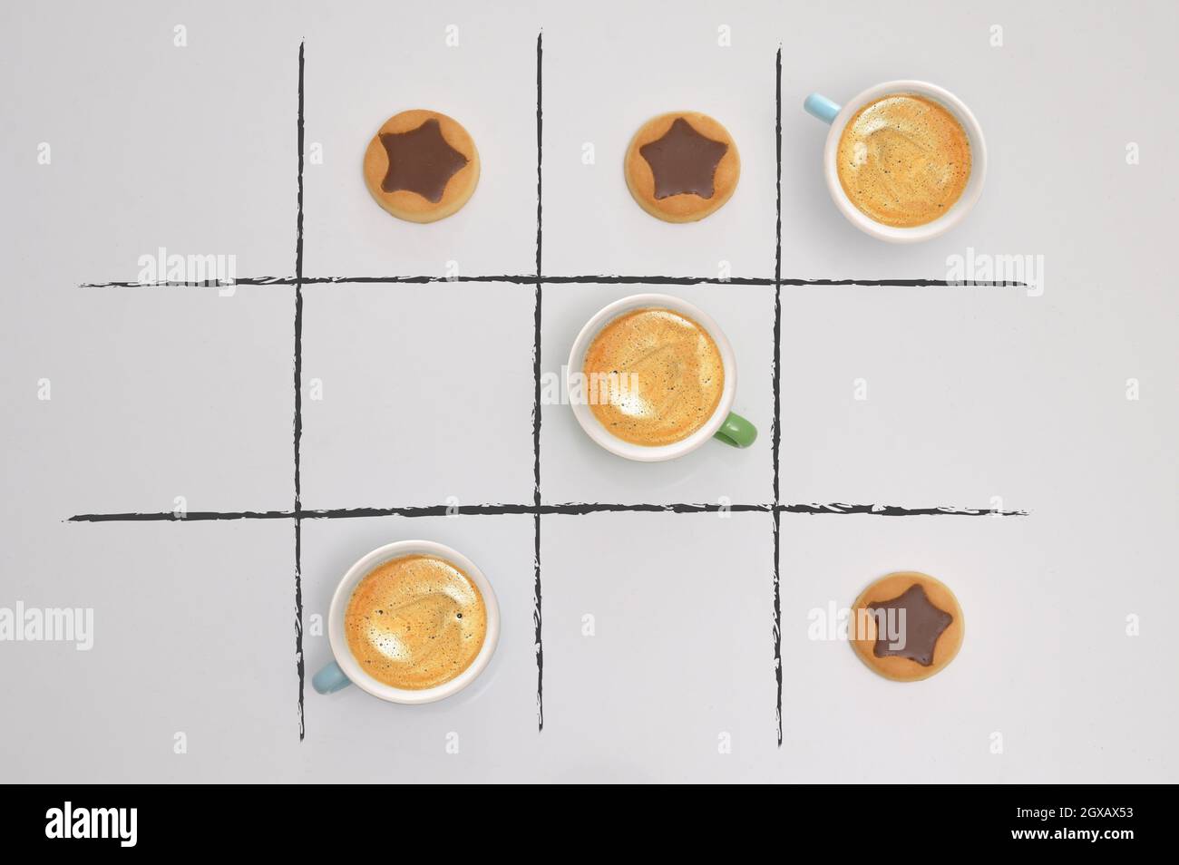 Game Of Tic-Tac-Toe from Cups of Espresso Coffee and Cookies Stock ...