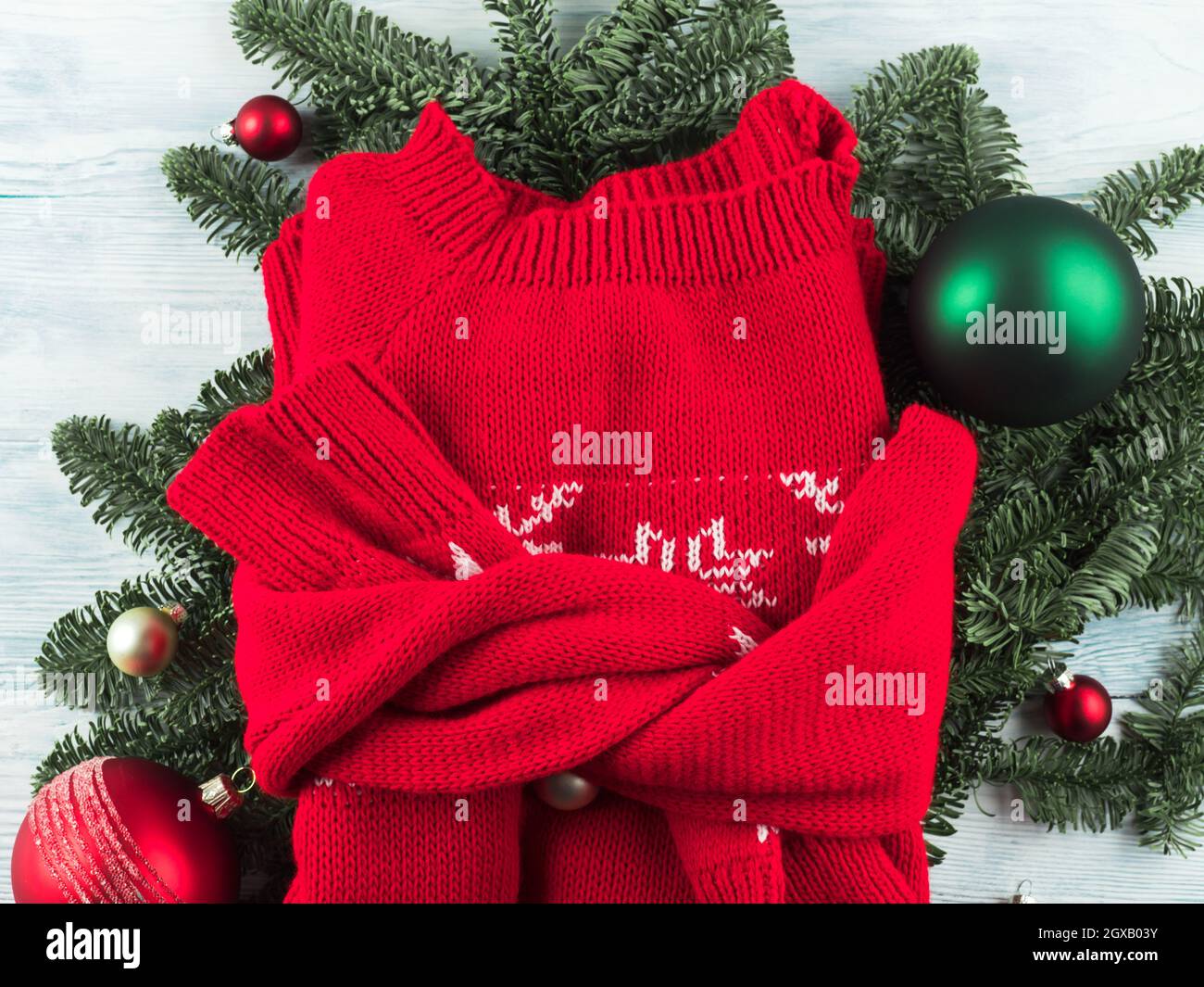 Traditional red ugly christmas new year winter sweater Stock Photo - Alamy