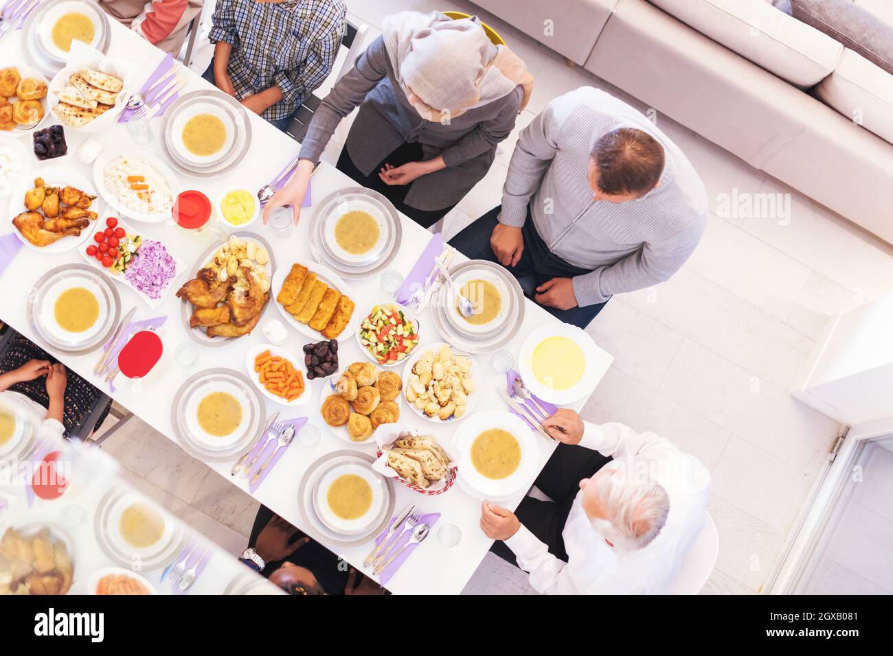 top view of modern multiethnic muslim family waiting for the beginning ...