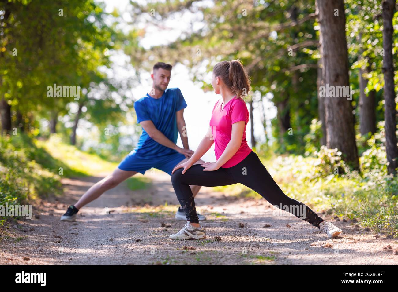 young happy couple enjoying in a healthy lifestyle warming up and ...