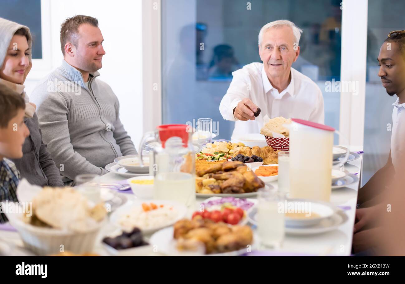 modern multiethnic muslim family enjoying eating iftar dinner together ...