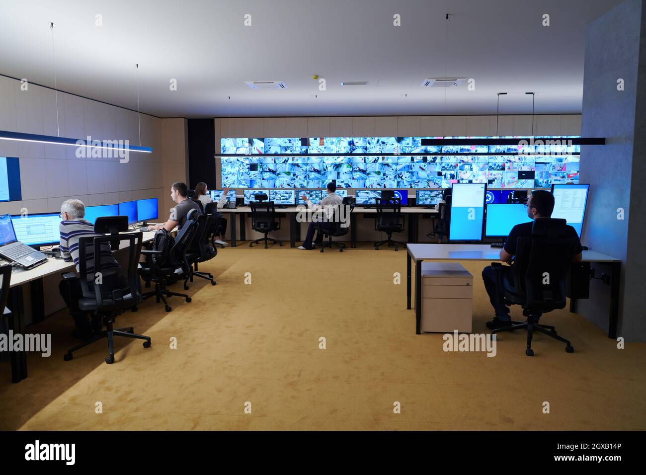 Group of Security data center operators working in a CCTV monitoring ...