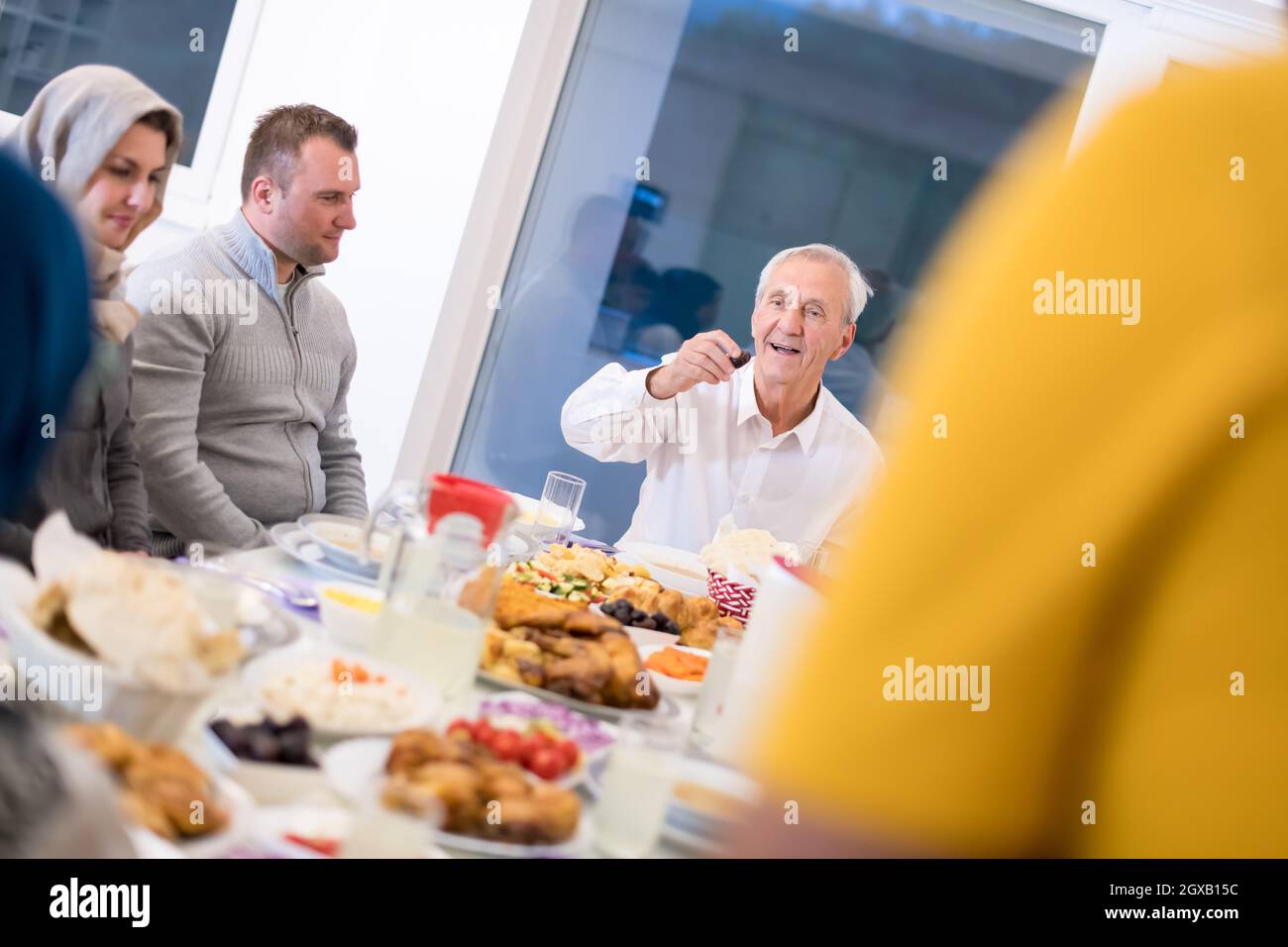 modern multiethnic muslim family enjoying eating iftar dinner together ...