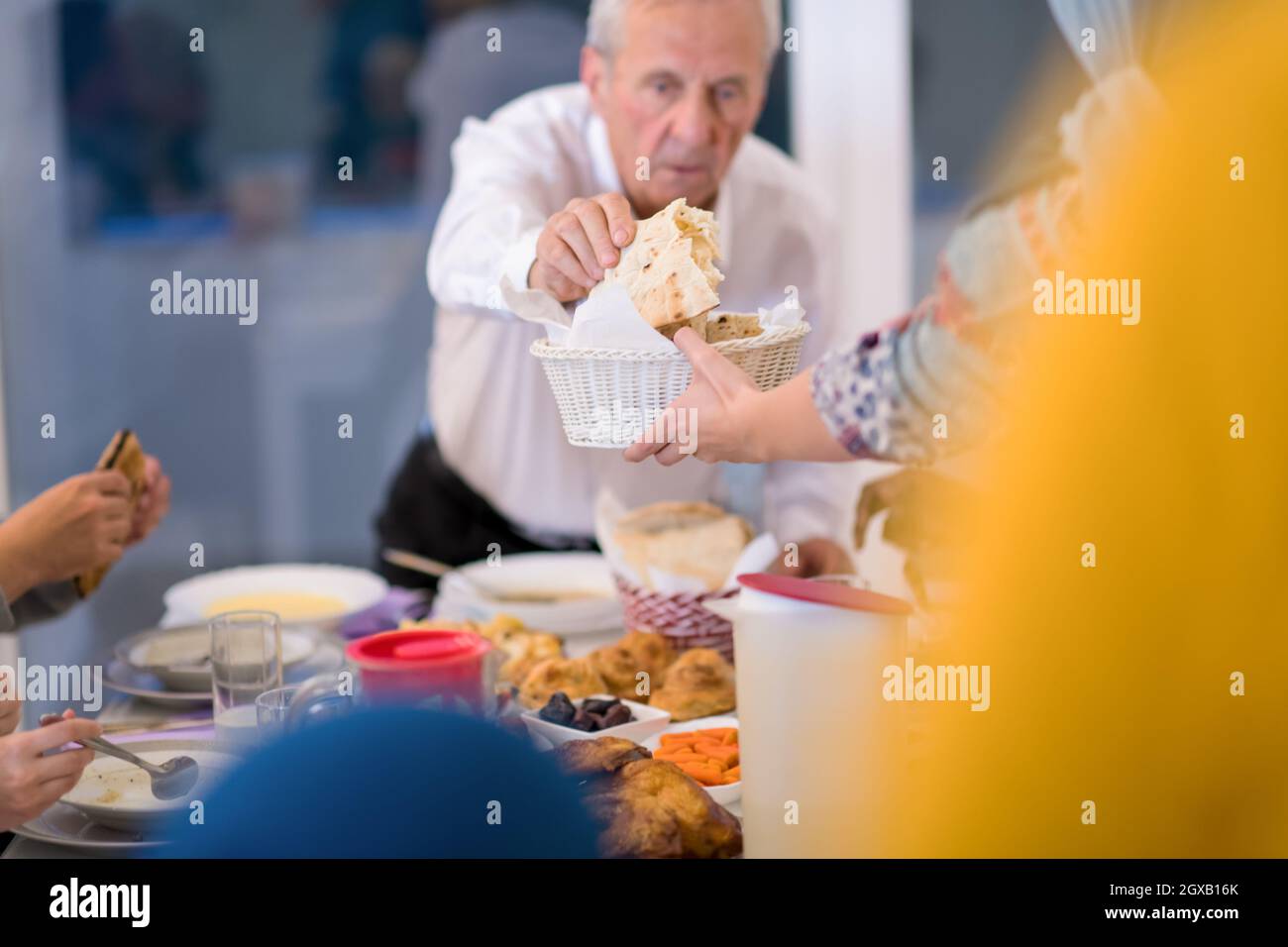 modern multiethnic muslim family enjoying eating iftar dinner together ...
