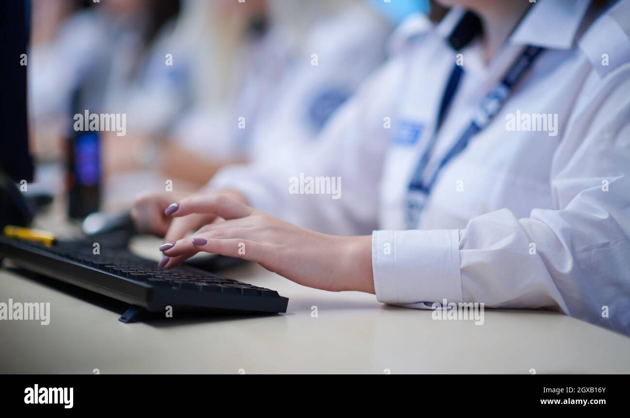 group of female security operators working in a data system control ...