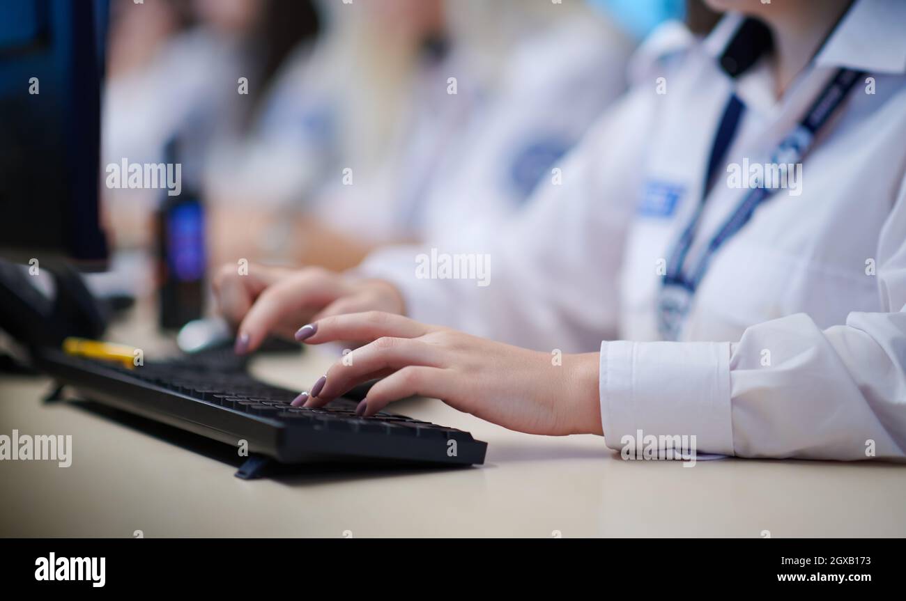 group of female security operators working in a data system control ...