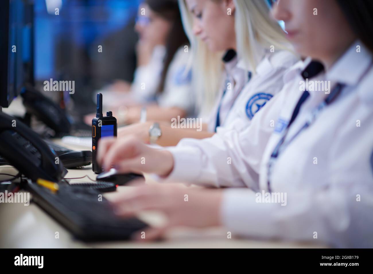 group of female security operators working in a data system control ...