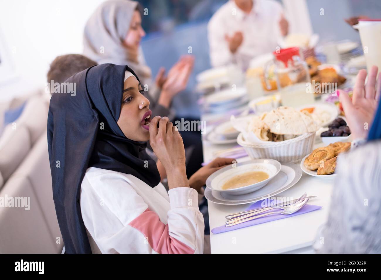 modern african american muslim woman enjoying iftar dinner together ...
