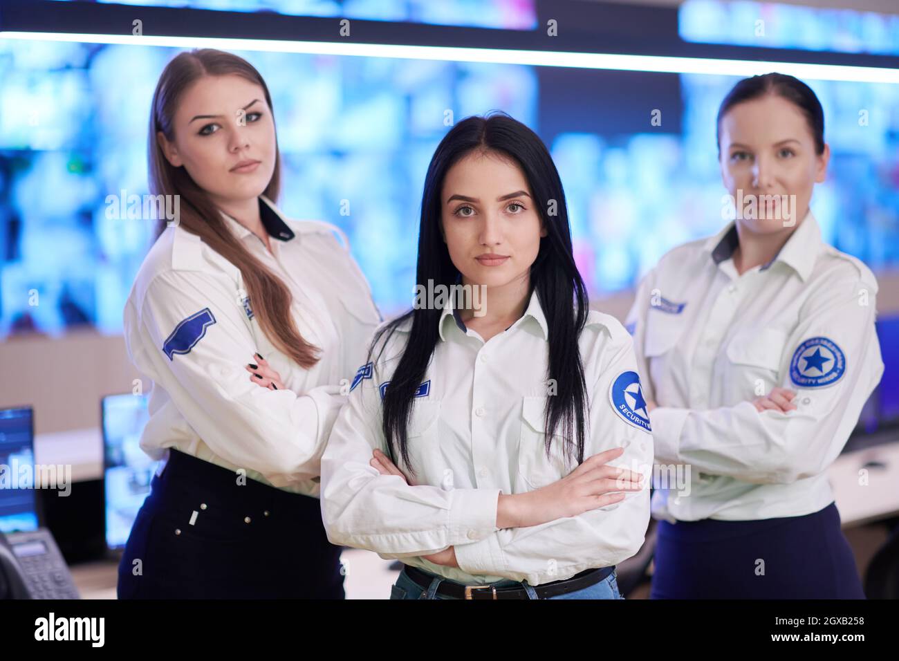 group portrait of female security operator while working in a data ...
