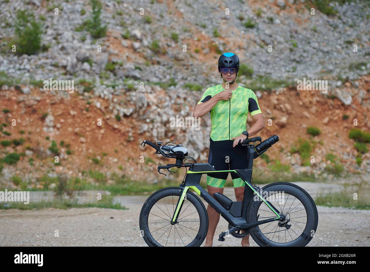 triathlon athlete riding professional racing bike at workout on curvy country road Stock Photo ...