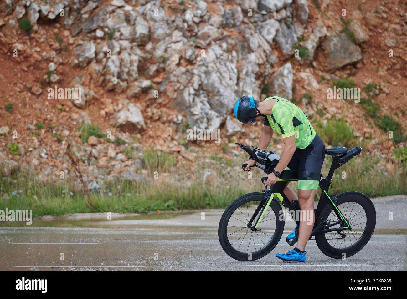 triathlon athlete riding professional racing bike at workout on curvy country road Stock Photo ...