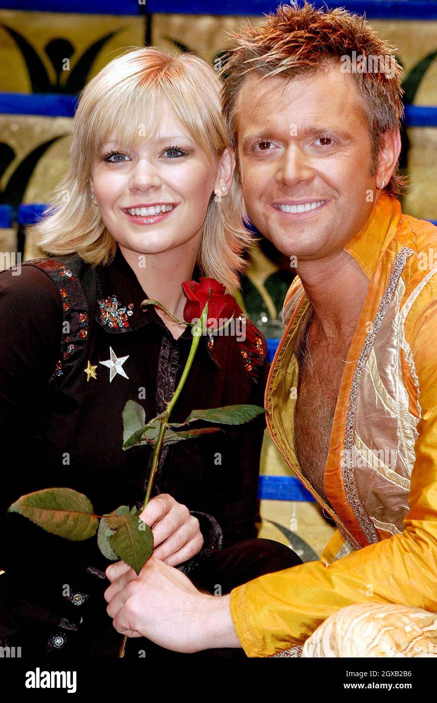 Darren Day and Suzanne Shaw pose with a dozen red roses at the New ...