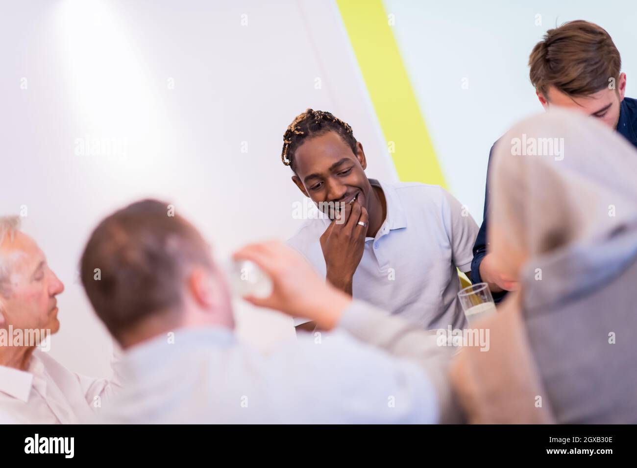 african american man enjoying iftar dinner together with modern ...