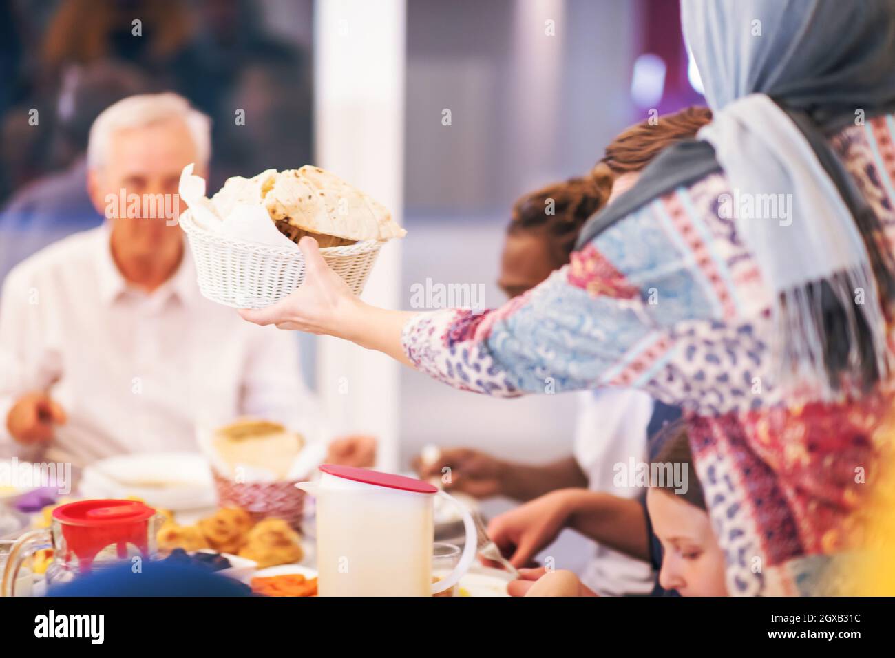 modern multiethnic muslim family enjoying eating iftar dinner together ...