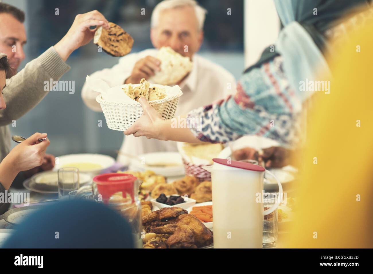 modern multiethnic muslim family enjoying eating iftar dinner together ...