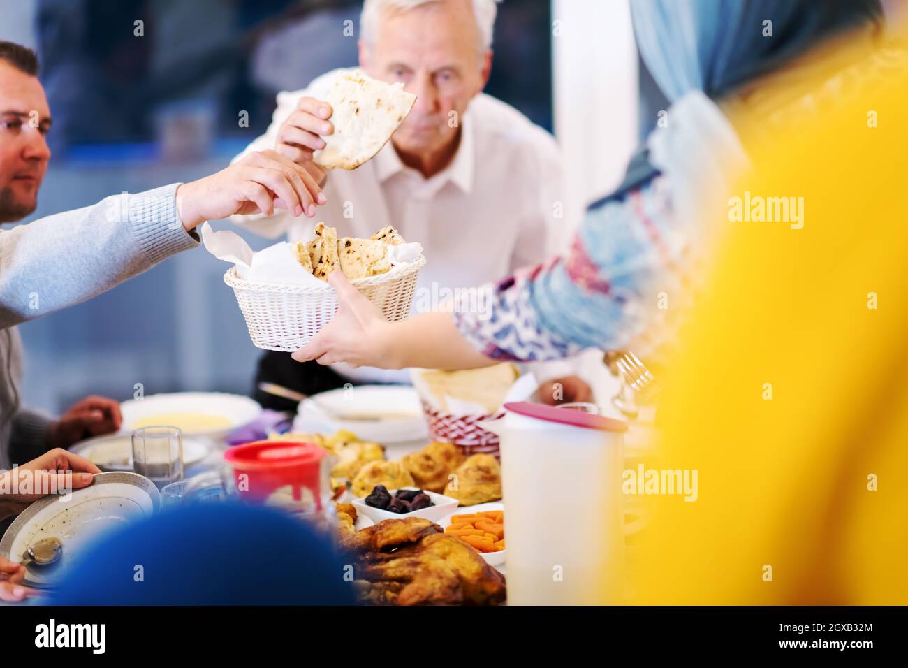 modern multiethnic muslim family enjoying eating iftar dinner together ...