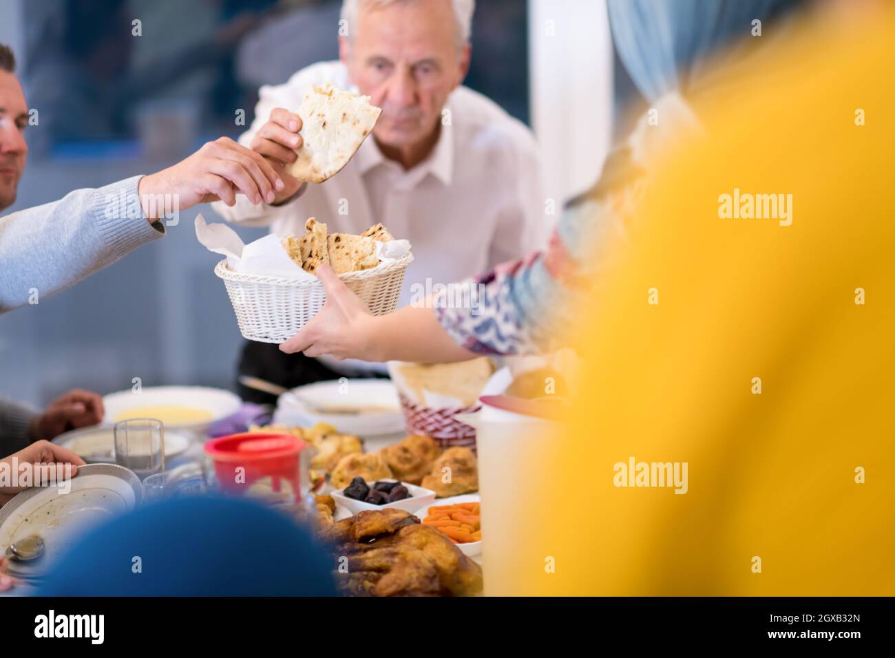 modern multiethnic muslim family enjoying eating iftar dinner together ...
