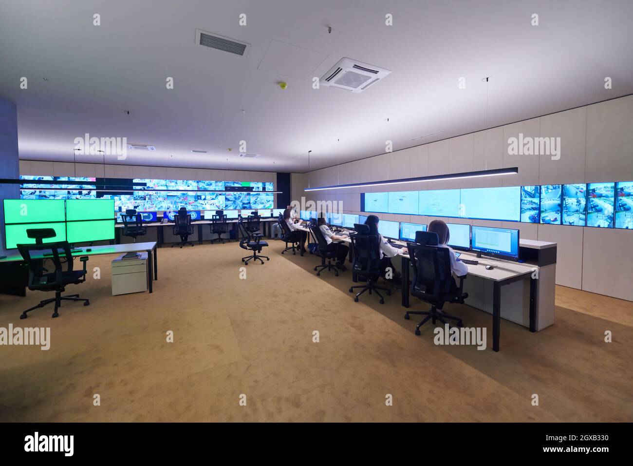Group of Security data center operators working in a CCTV monitoring ...