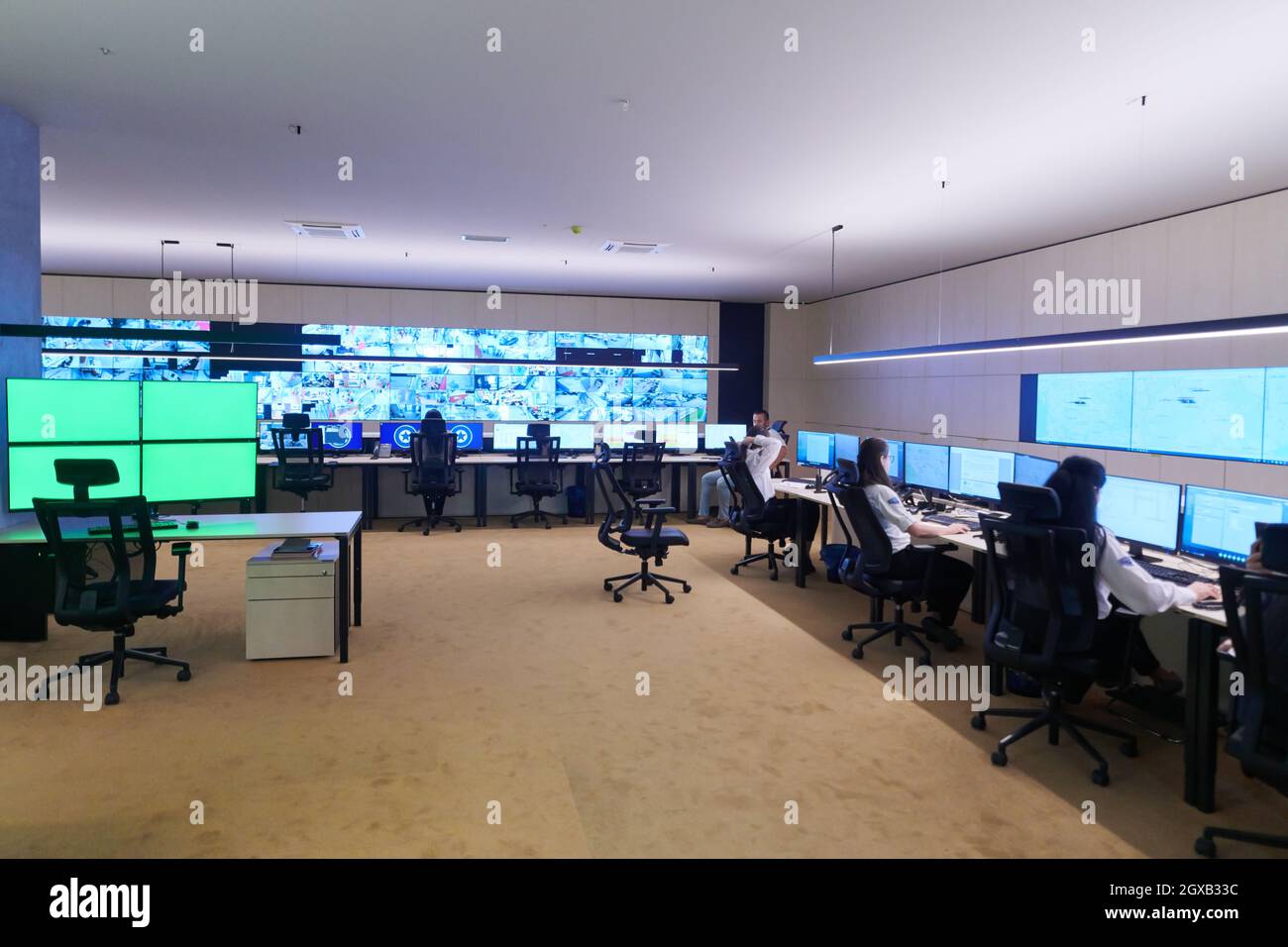 Group of Security data center operators working in a CCTV monitoring ...