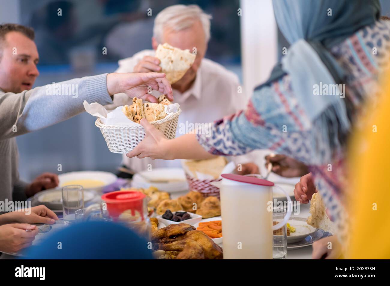 modern multiethnic muslim family enjoying eating iftar dinner together ...