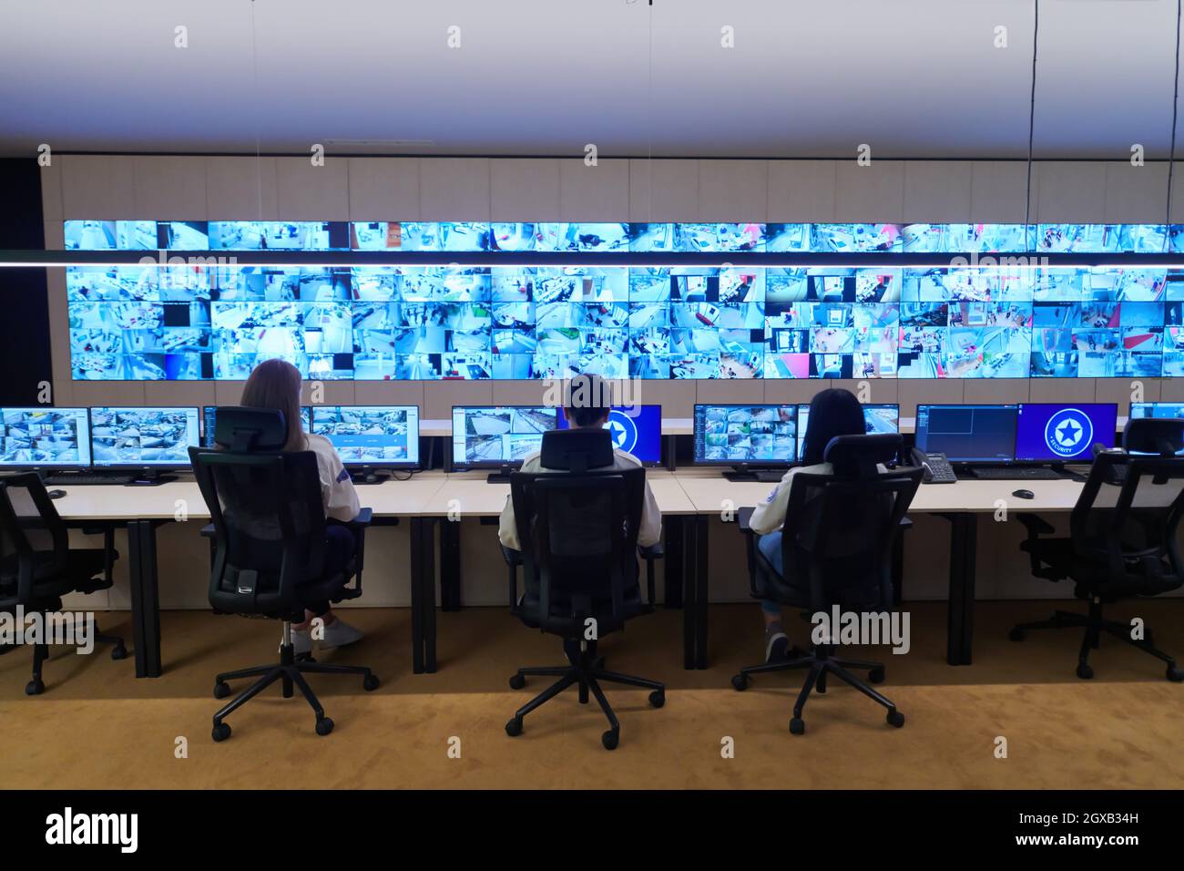 Group of Security data center operators working in a CCTV monitoring ...