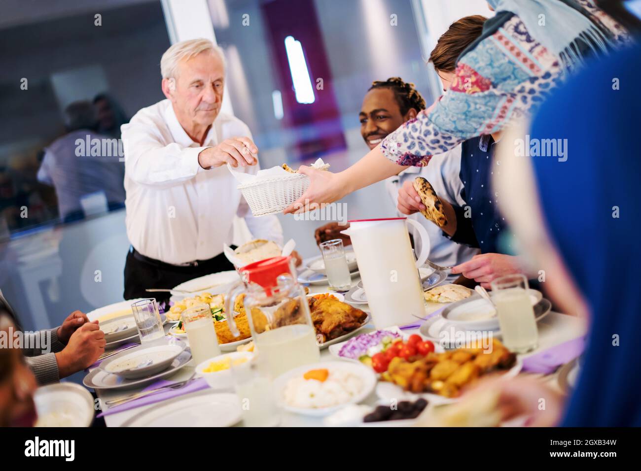 modern multiethnic muslim family enjoying eating iftar dinner together ...