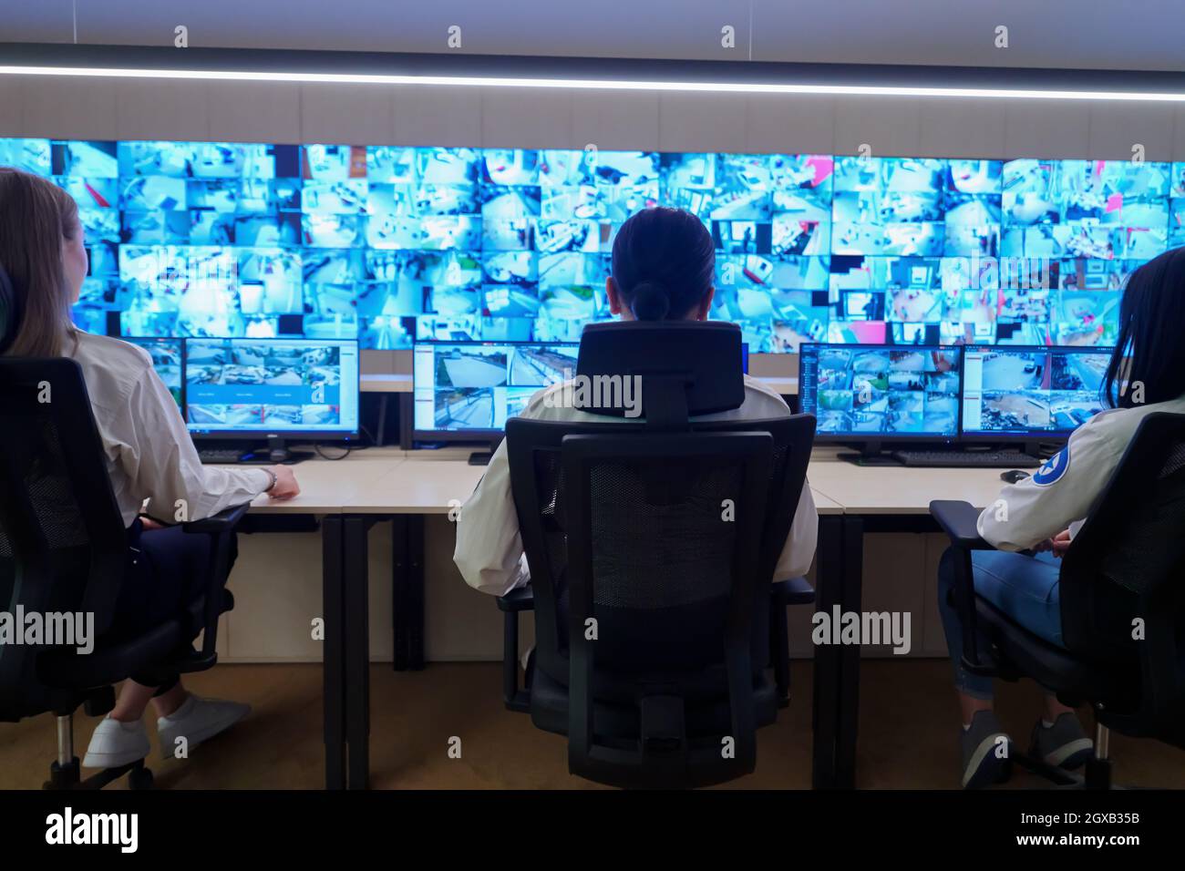 Group of Security data center operators working in a CCTV monitoring ...