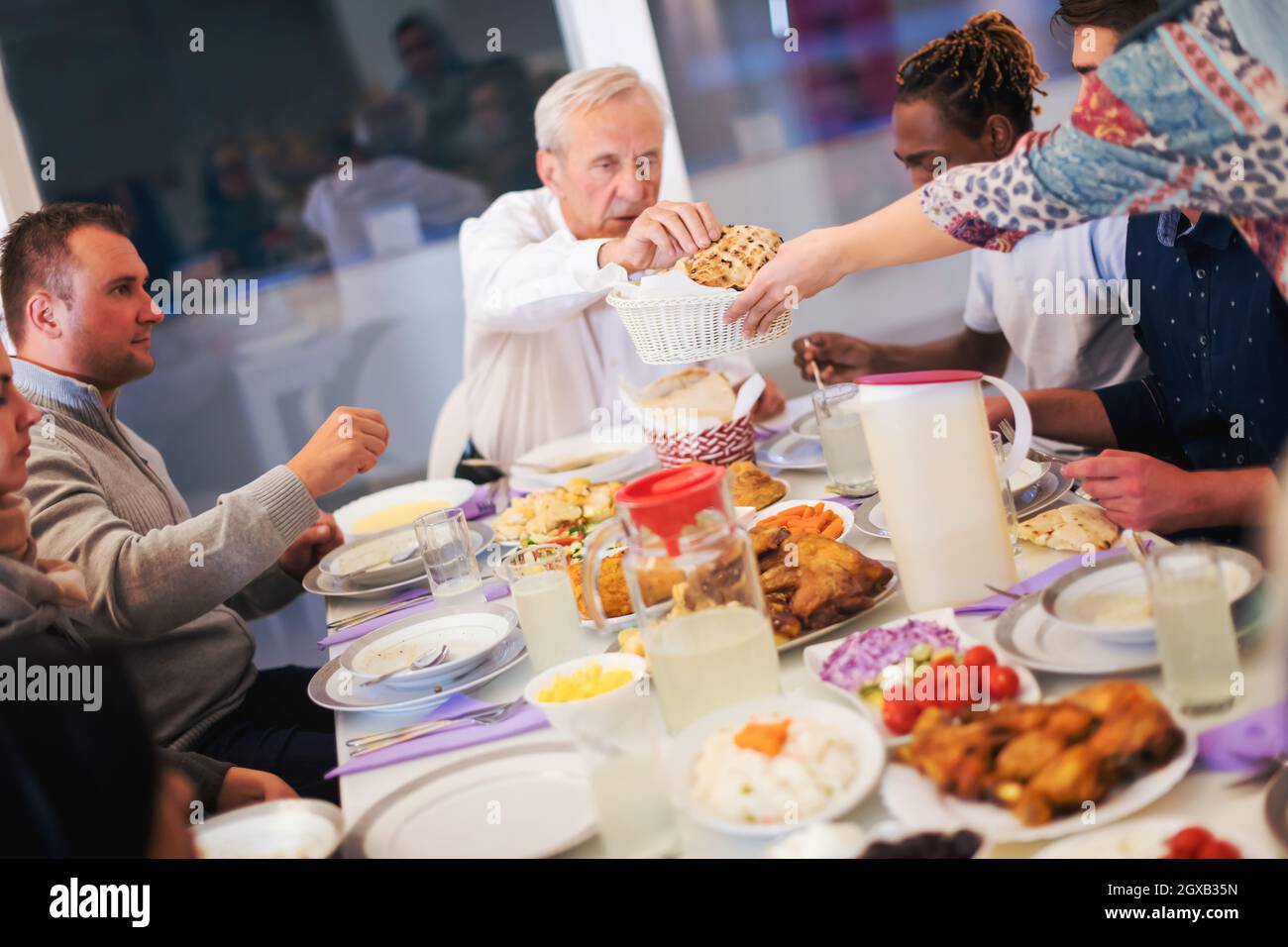 modern multiethnic muslim family enjoying eating iftar dinner together ...
